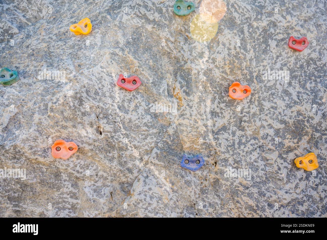 Close up view of a short rock climbing wall on the playground, concept ...