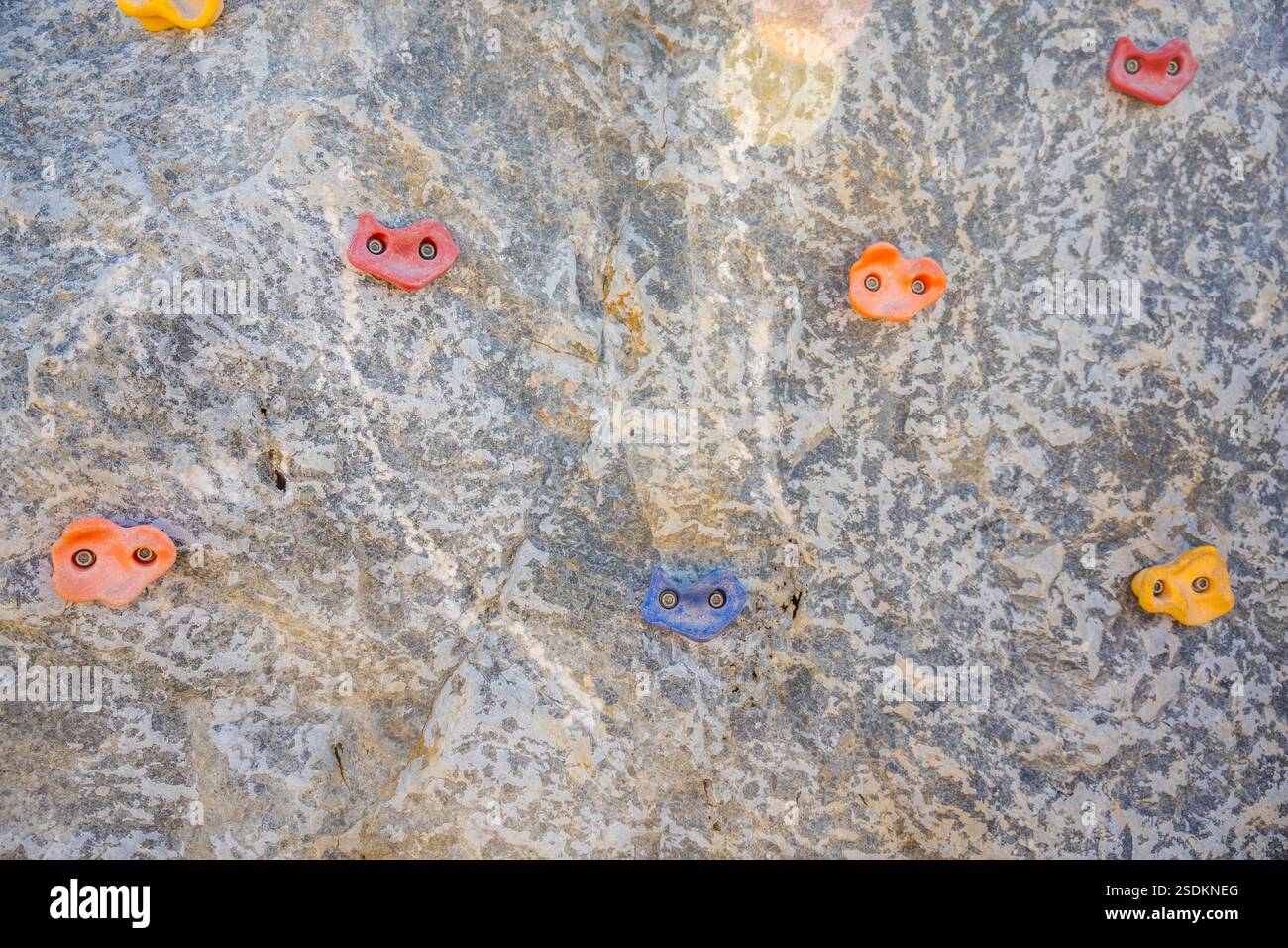 Close up view of a short rock climbing wall on the playground, concept ...