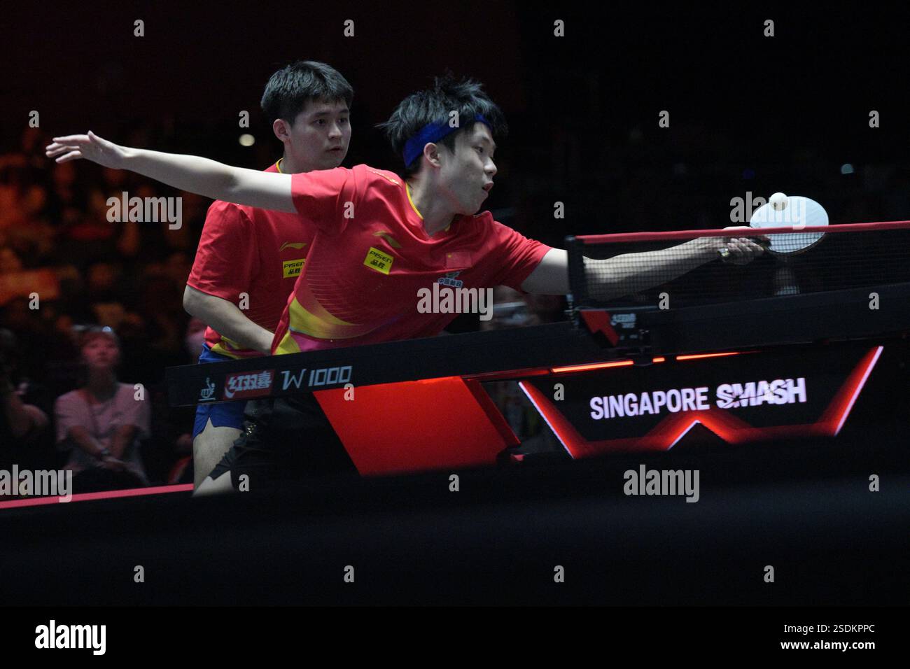 Singapore. 8th Feb, 2025. Wang Chuqin (front)/Lin Shidong of China compete during the men's ...