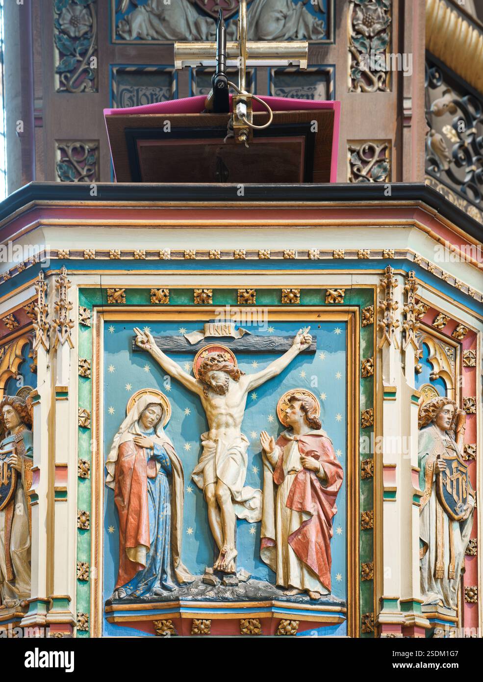 Painted wooden pulpit, featuring the crucifixion of Jesus Christ, in ...