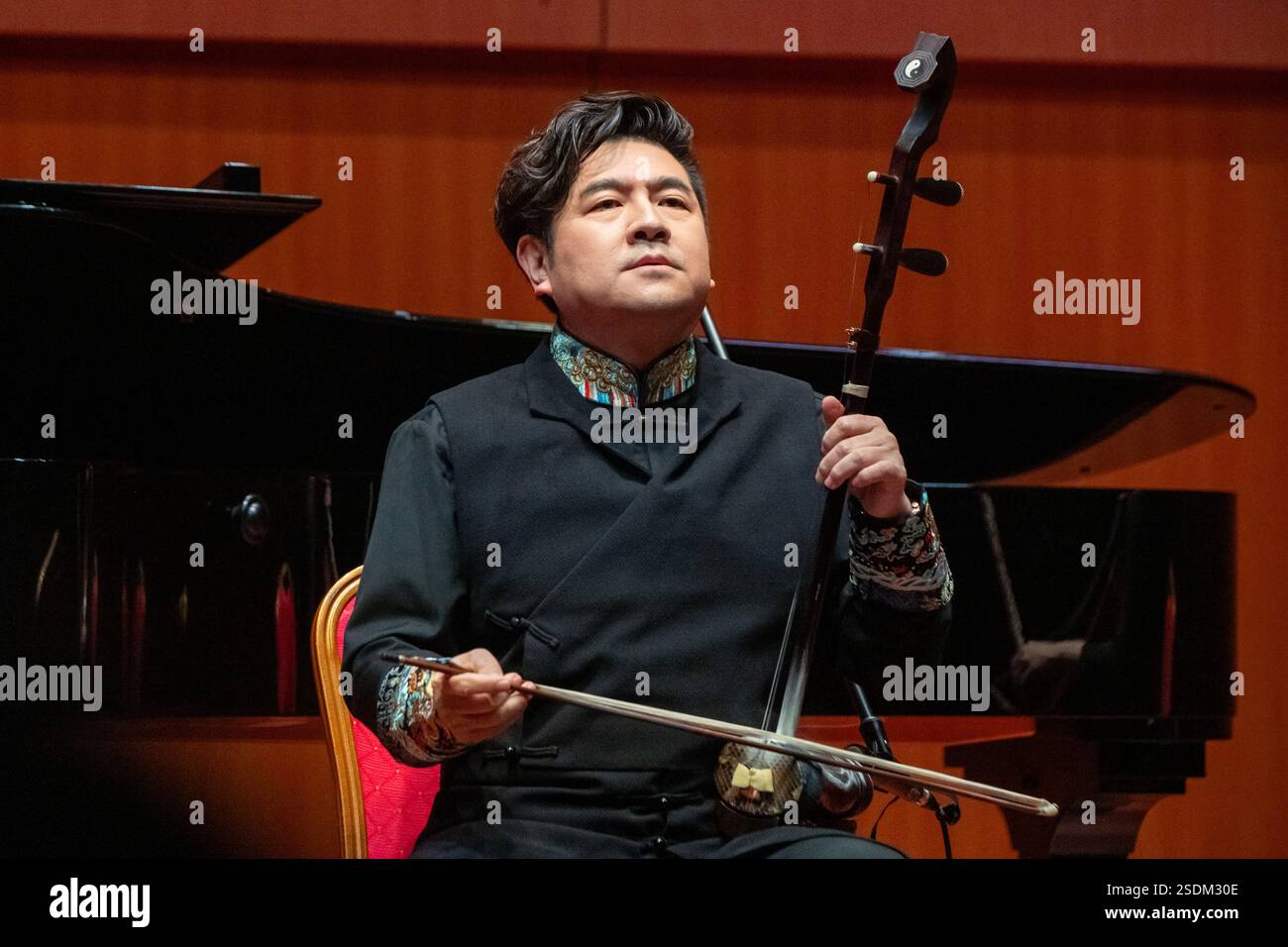 Kuala Lumpur, Malaysia. 6th Feb, 2025. Artist Chen Jun plays erhu, a ...
