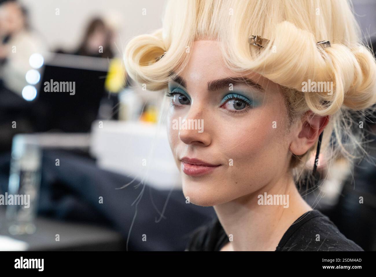 New York, NY, February 7, 2025: Model prepares backstage for Christian ...