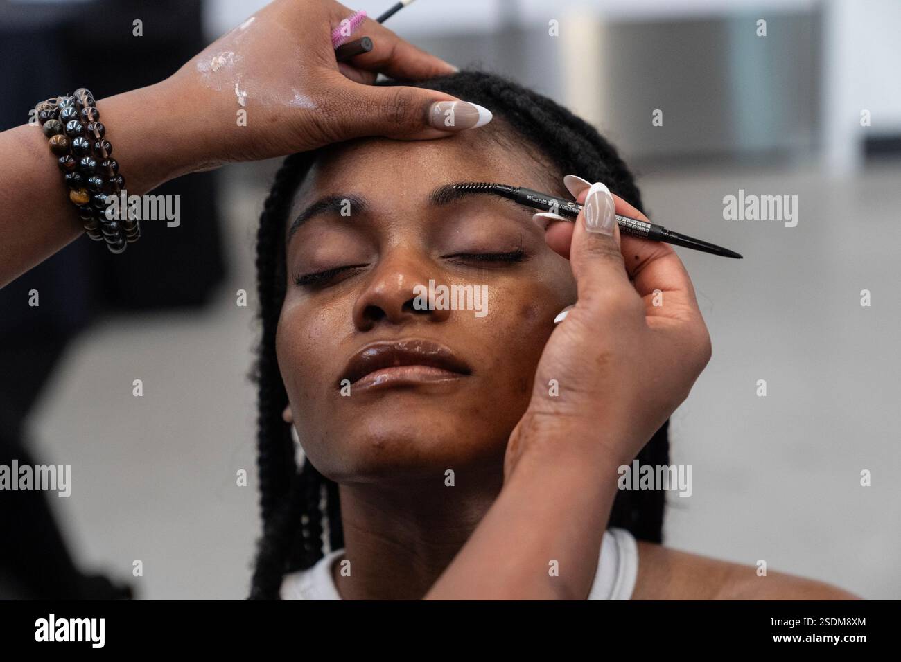 New York, USA. 07th Feb, 2025. Model prepares backstage for Christian ...