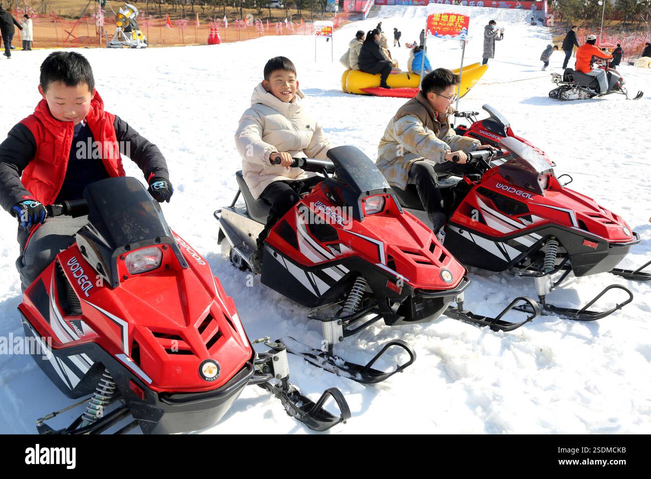 Tourists enjoy snow fun at a snow park in Lianyungang City, east China ...