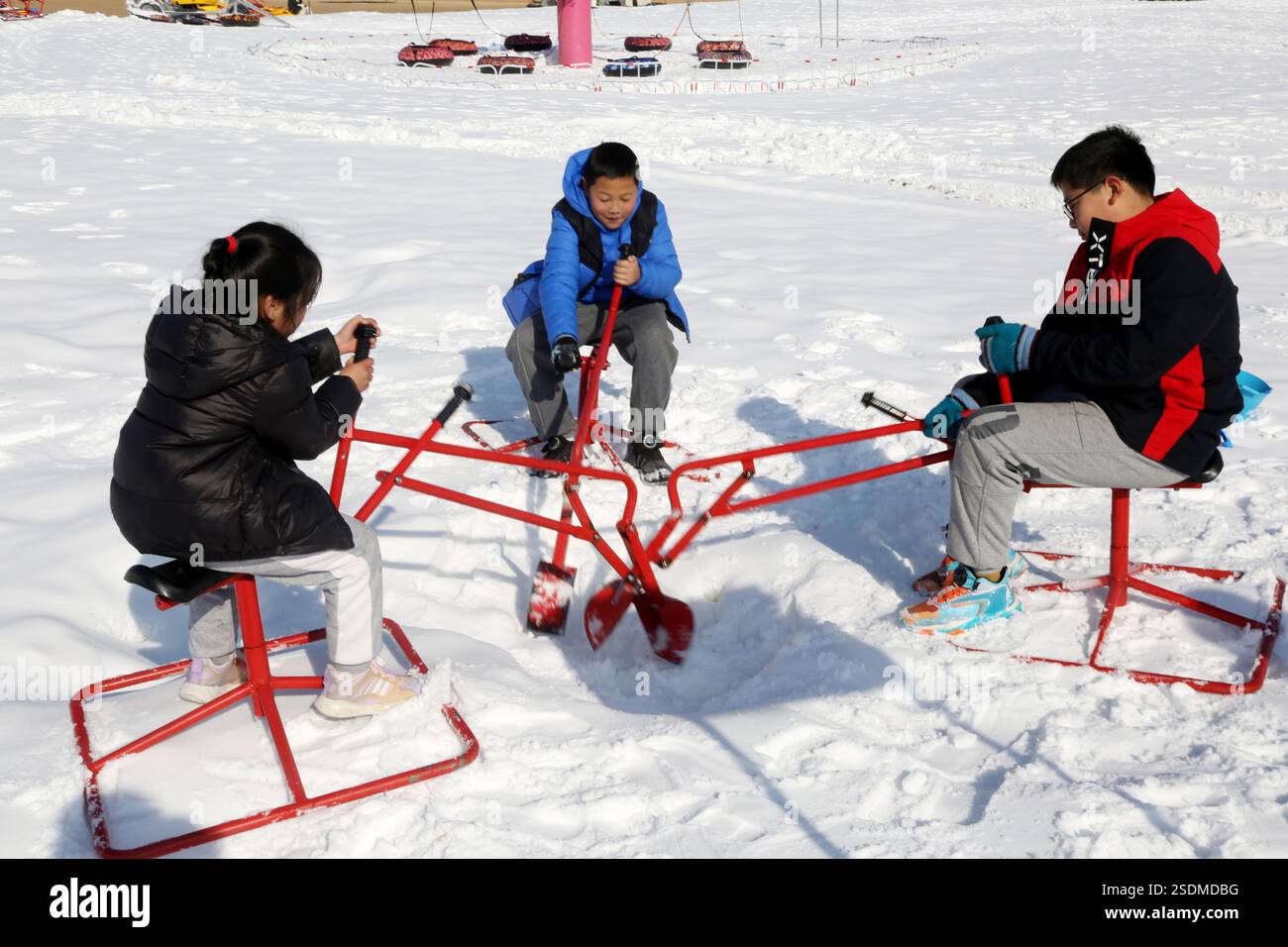 Tourists enjoy snow fun at a snow park in Lianyungang City, east China ...