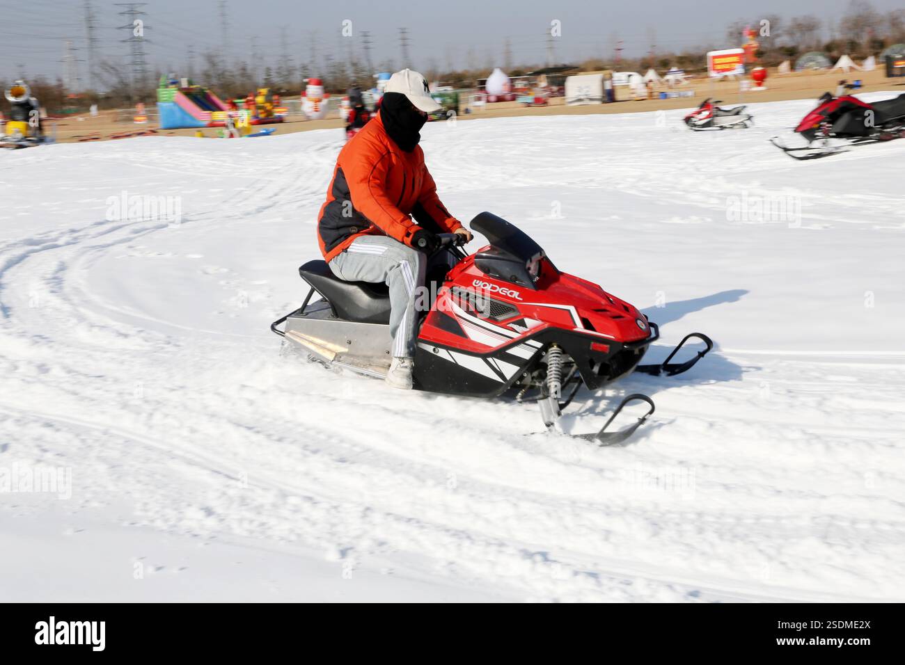 Tourists enjoy snow fun at a snow park in Lianyungang City, east China ...