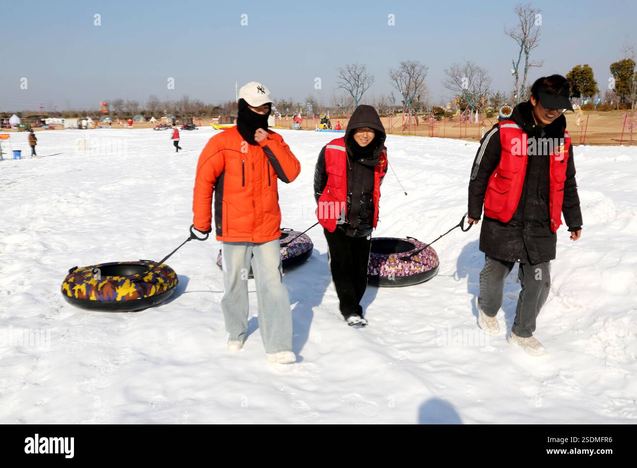 Tourists enjoy snow fun at a snow park in Lianyungang City, east China ...