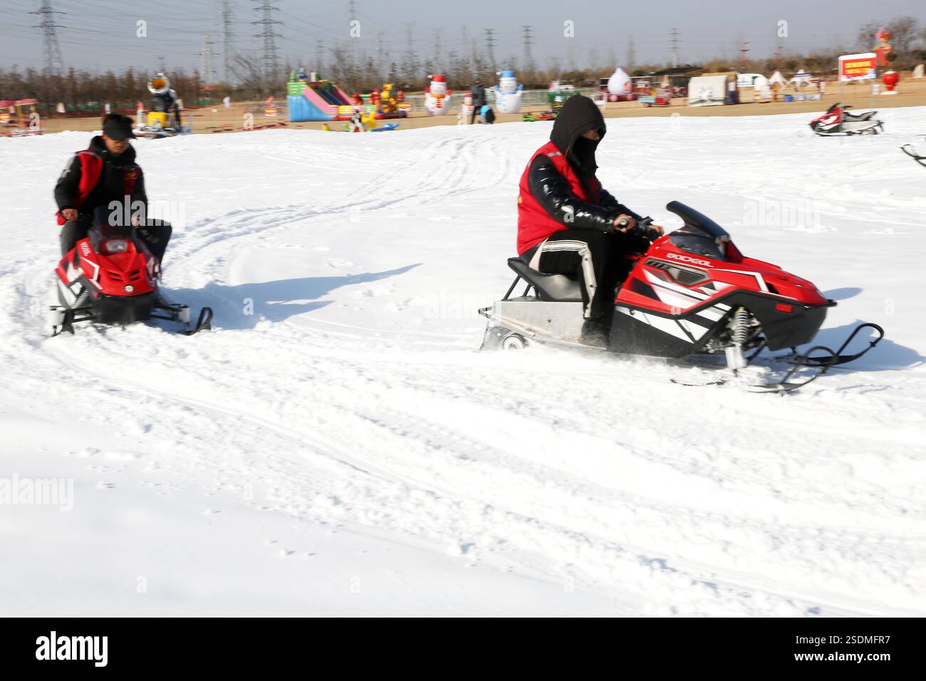 Tourists enjoy snow fun at a snow park in Lianyungang City, east China ...