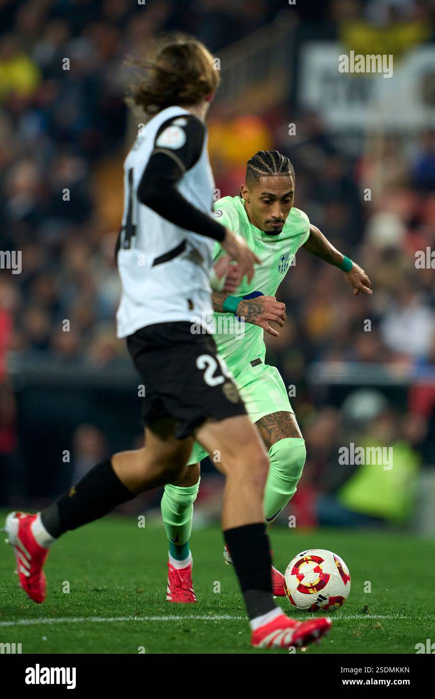 Raphinha of FC Barcelona, Yarek Gasiorowski of Valencia CF in action ...