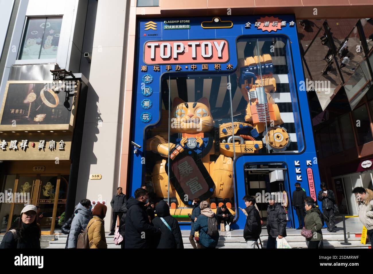 Customers shop at the newly opened flagship store of TOP TOY Tide Play ...