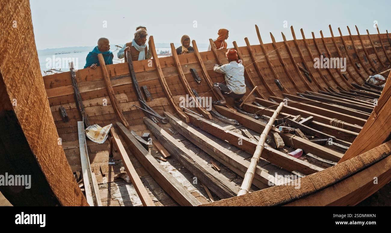 Varanasi, Uttar Pradesh, India. Indian men Workers are repairing and ...