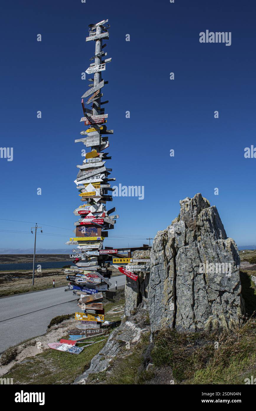 Totem with distance signs on a street in Stanley, Falkland Islands ...