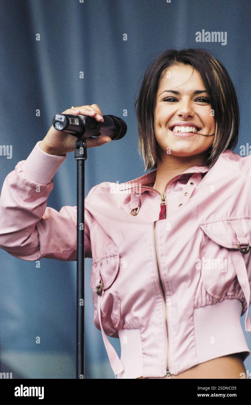 GIRLS ALOUD, FIRST UK TOUR, 2003: Cheryl Tweedy singing on the main ...