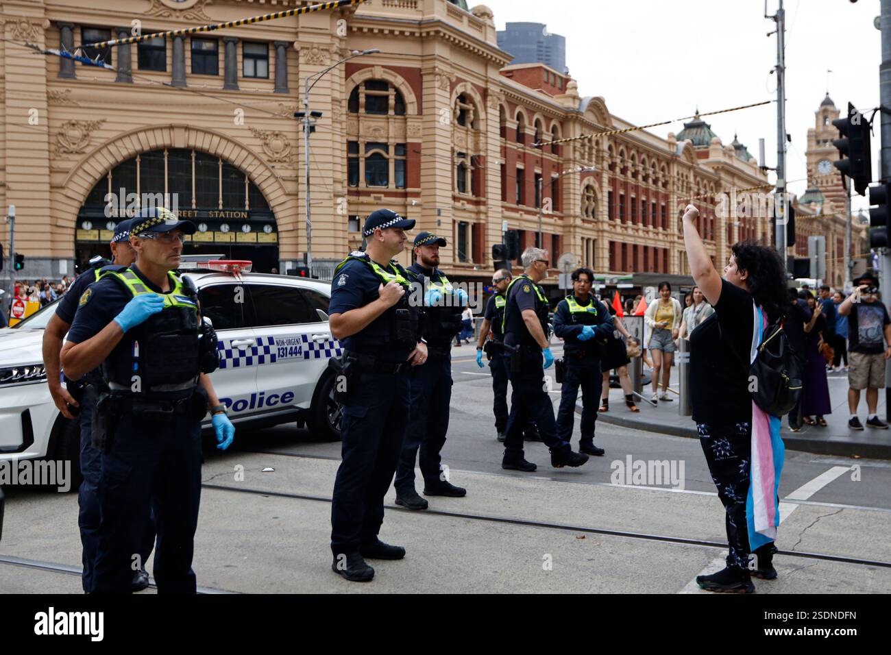 Victoria Police block the rally near Flinders Street Station as ...