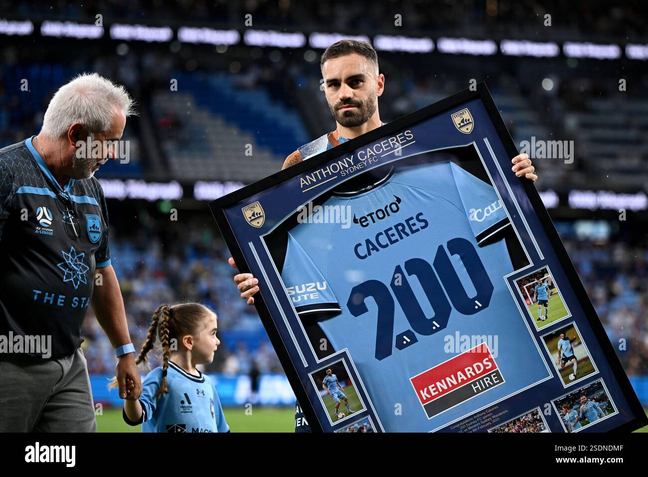Anthony Caceres of Sydney is presented with a commemorative guernsey ...