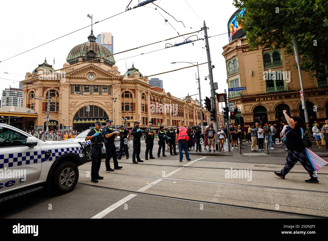 Victoria Police block the rally near Flinders Street Station as ...
