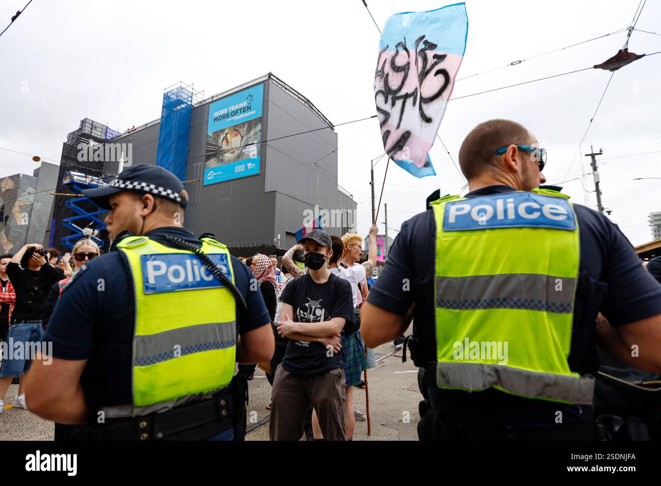 Victoria Police block the rally near Flinders Street Station as ...
