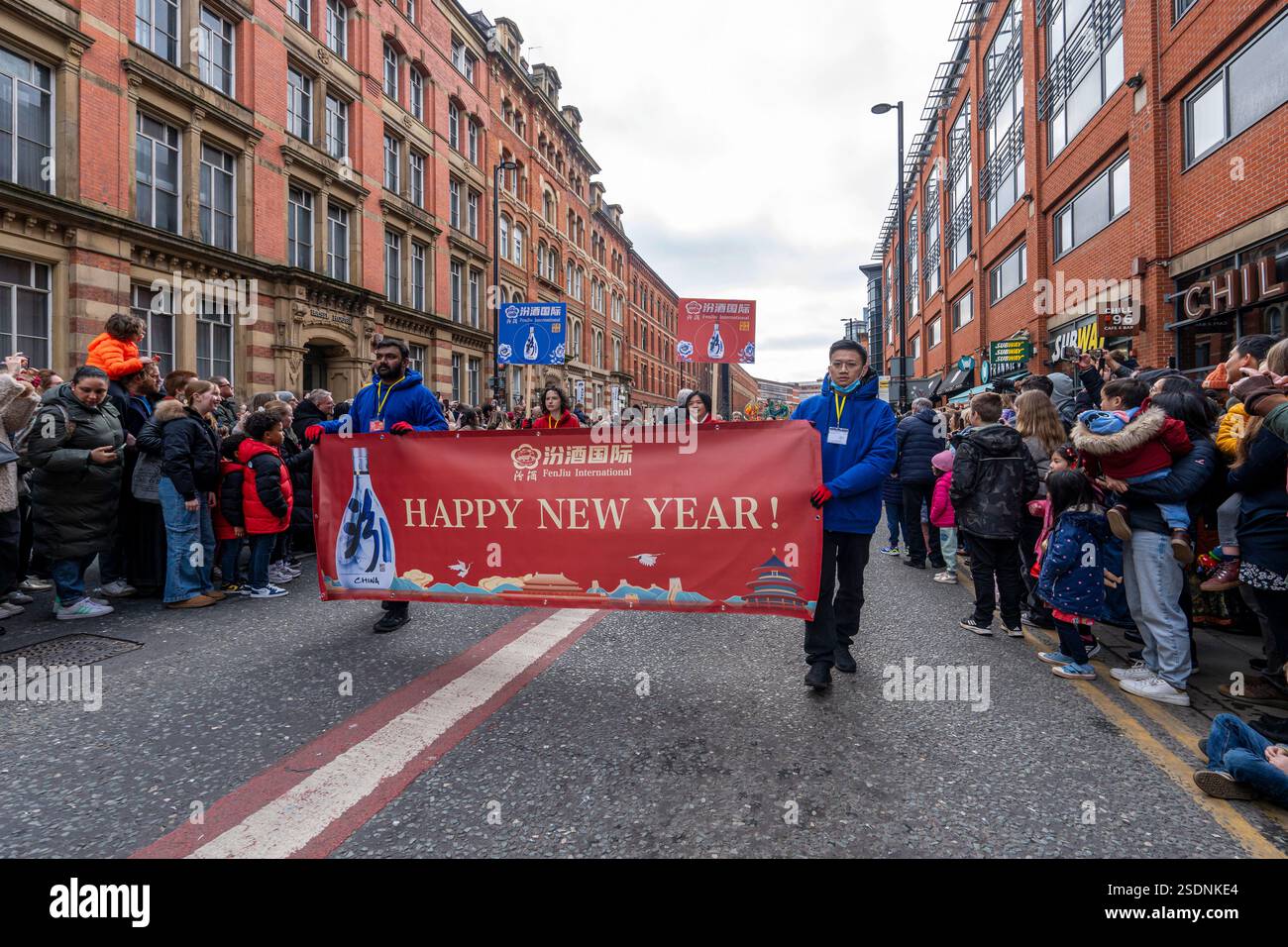 People marching for the Lunar New Year in Manchester UK Stock Photo - Alamy