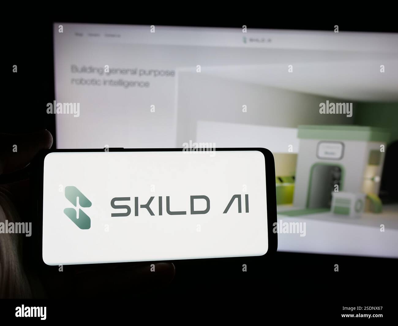 In this photo illustration, a person is holding a smartphone with the logo of US robotic ...