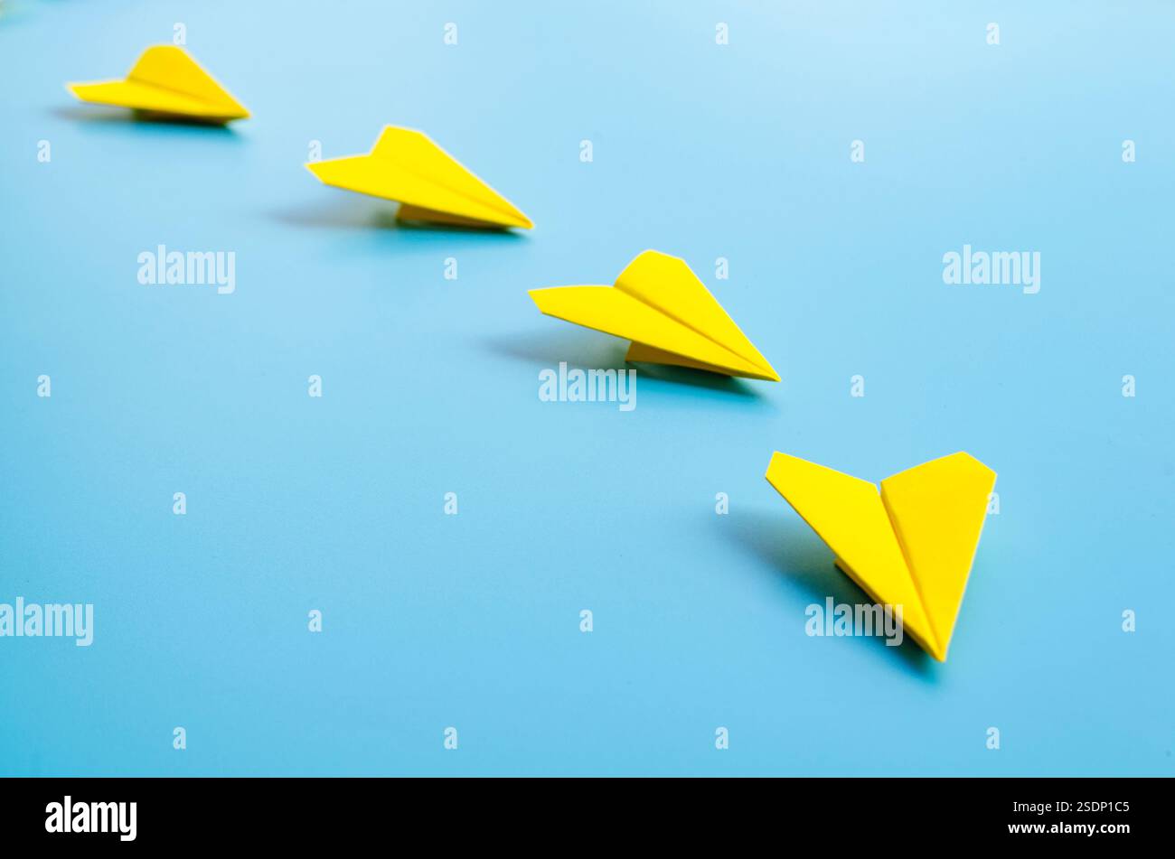 View of origami yellow paper airplane from vision to reality with the ...