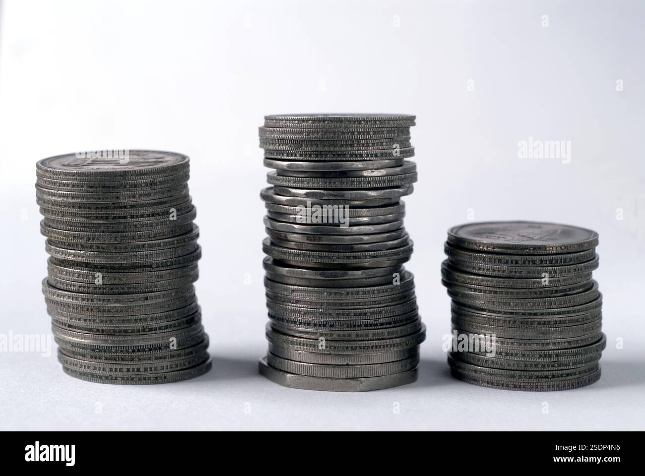 Coins many Indian Rupee round two stacks Stock Photo - Alamy