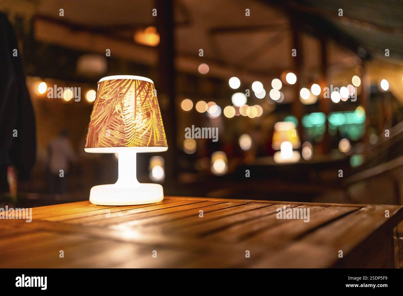 Soft, warm lighting creates a cozy atmosphere at a rustic wedding venue ...