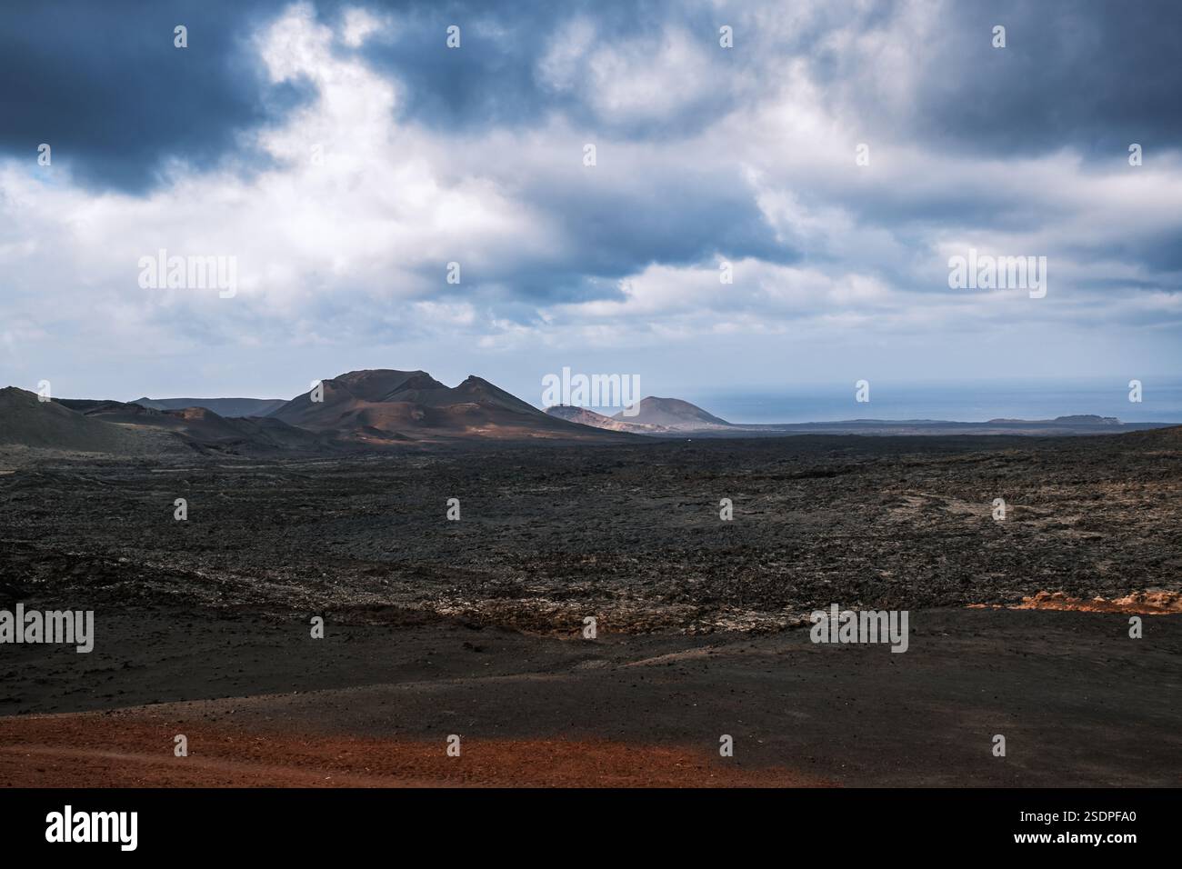 Breathtaking volcanic scenery with ebony sands, dramatic peaks, and ...