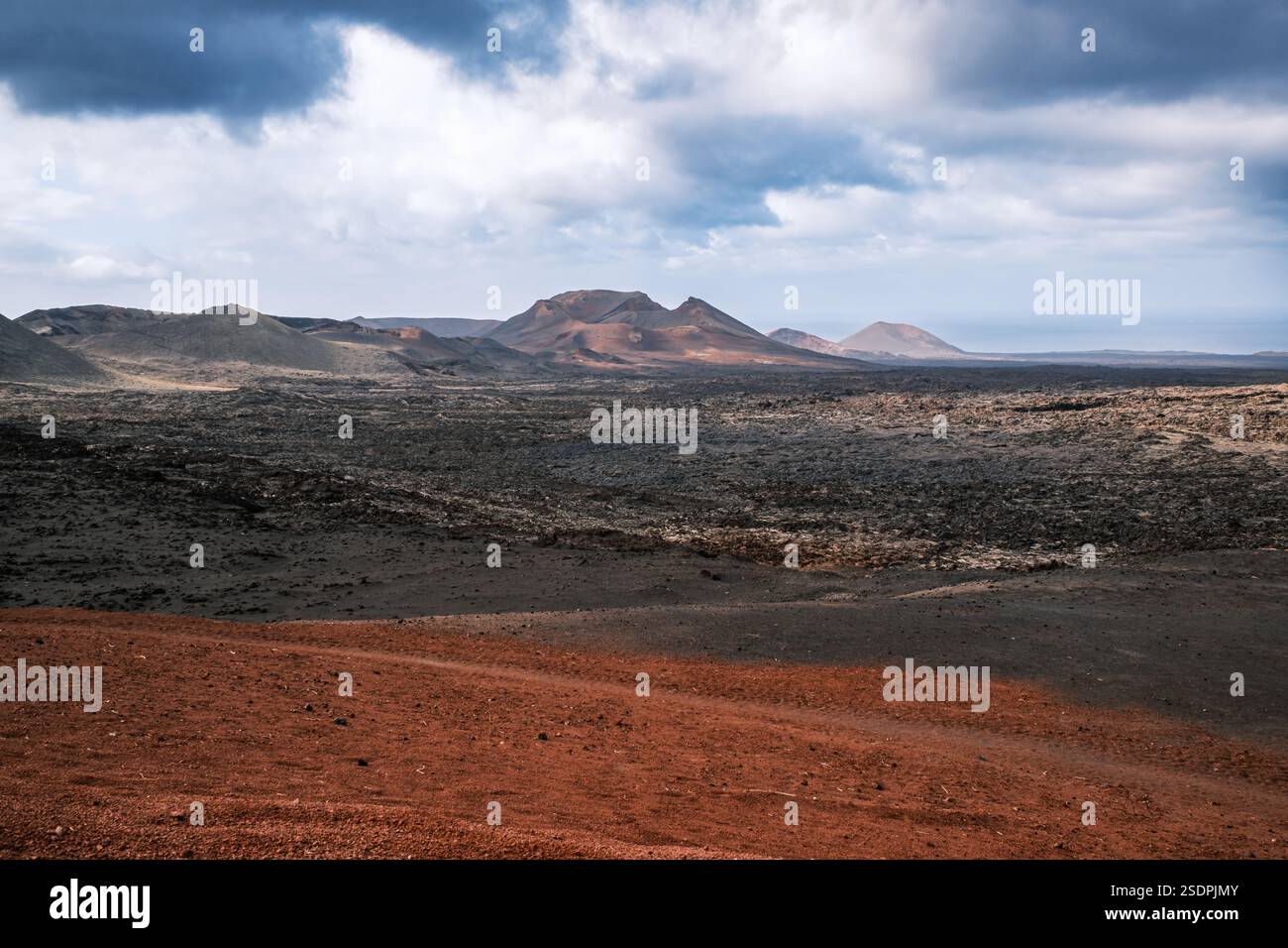 Breathtaking volcanic scenery with ebony sands, dramatic peaks, and ...