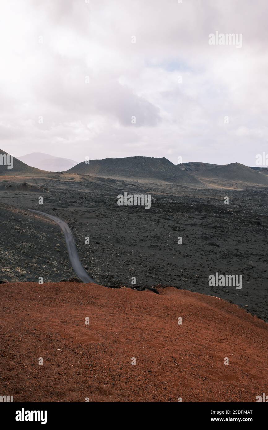Breathtaking volcanic scenery with ebony sands, dramatic peaks, and ...