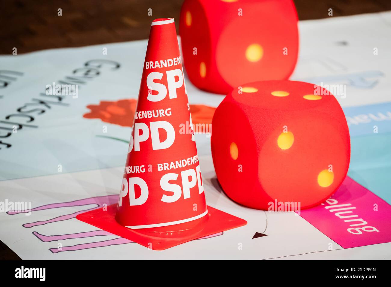 Potsdam, Germany. 08th Feb, 2025. An SPD hat stands on a playing field ...