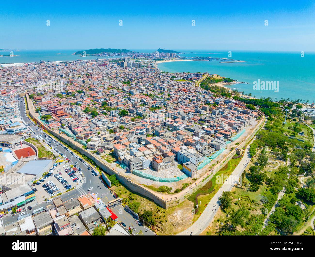 Aerial View of a Coastal City with a Curved Beach and Blue Ocean Stock ...
