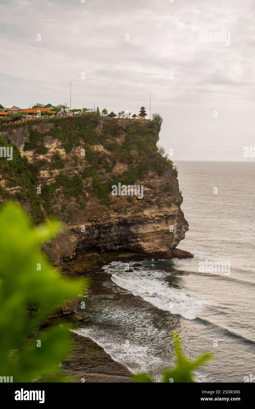 Sacred pagodas with terracotta roofs stand sentinel on towering cliffs ...