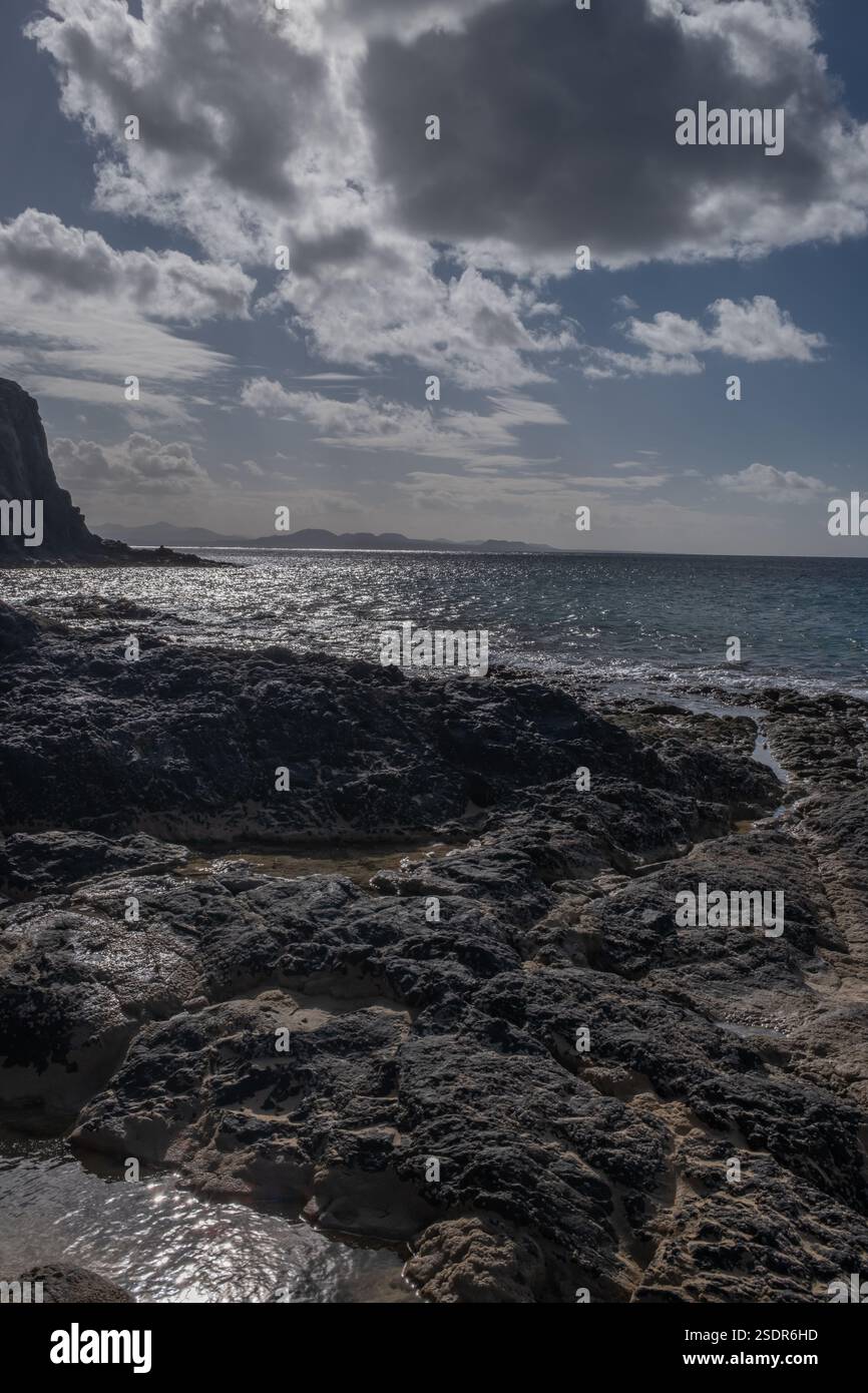 Breathtaking volcanic scenery with ebony sands, dramatic peaks, and ...