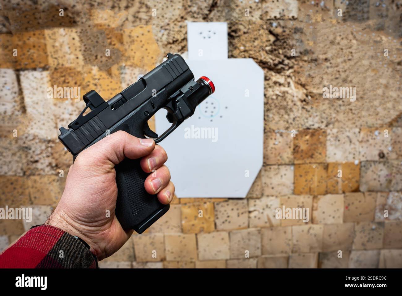 Self-defense shooting training with a compact tactical pistol. Photo ...
