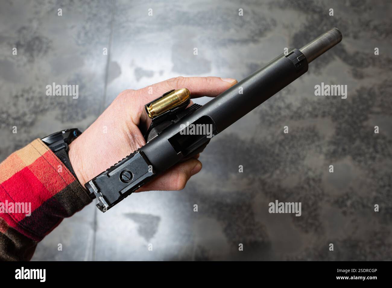 Unloaded pistol in a man's hand, close-up photo Stock Photo - Alamy