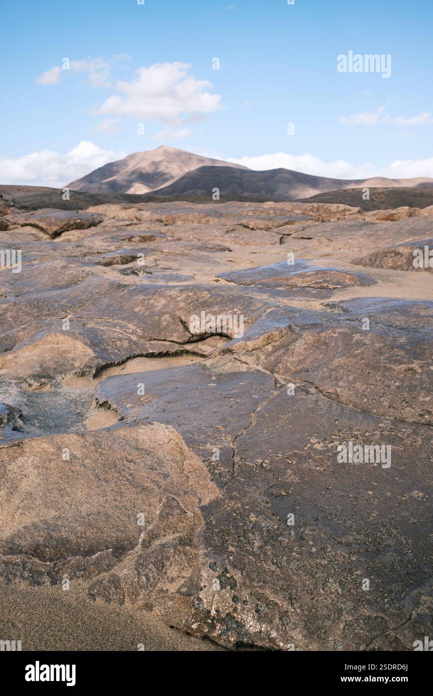 Breathtaking volcanic scenery with ebony sands, dramatic peaks, and ...