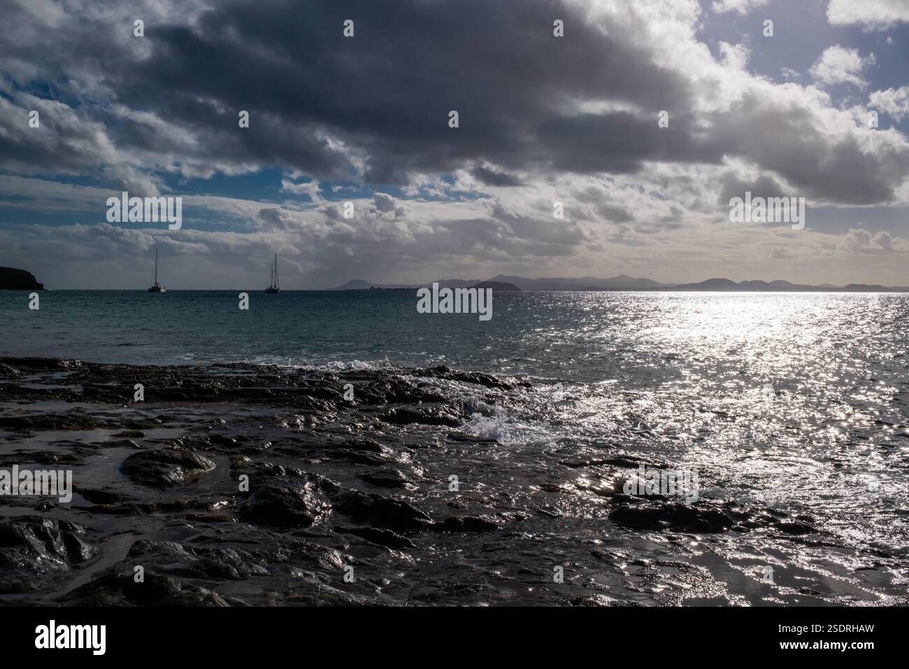 Breathtaking volcanic scenery with ebony sands, dramatic peaks, and ...