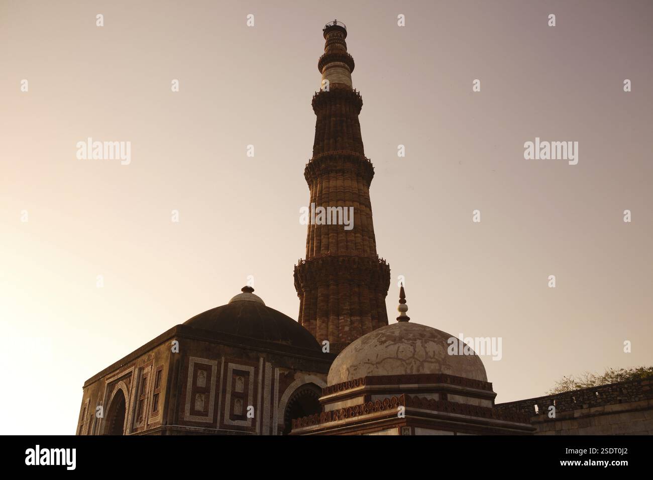 Sunset at Alai Darwaza Imam Zamin's tomb and Qutab Minar built in 1311 ...
