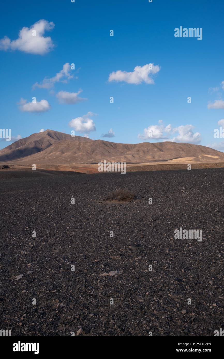 Breathtaking volcanic scenery with ebony sands, dramatic peaks, and ...