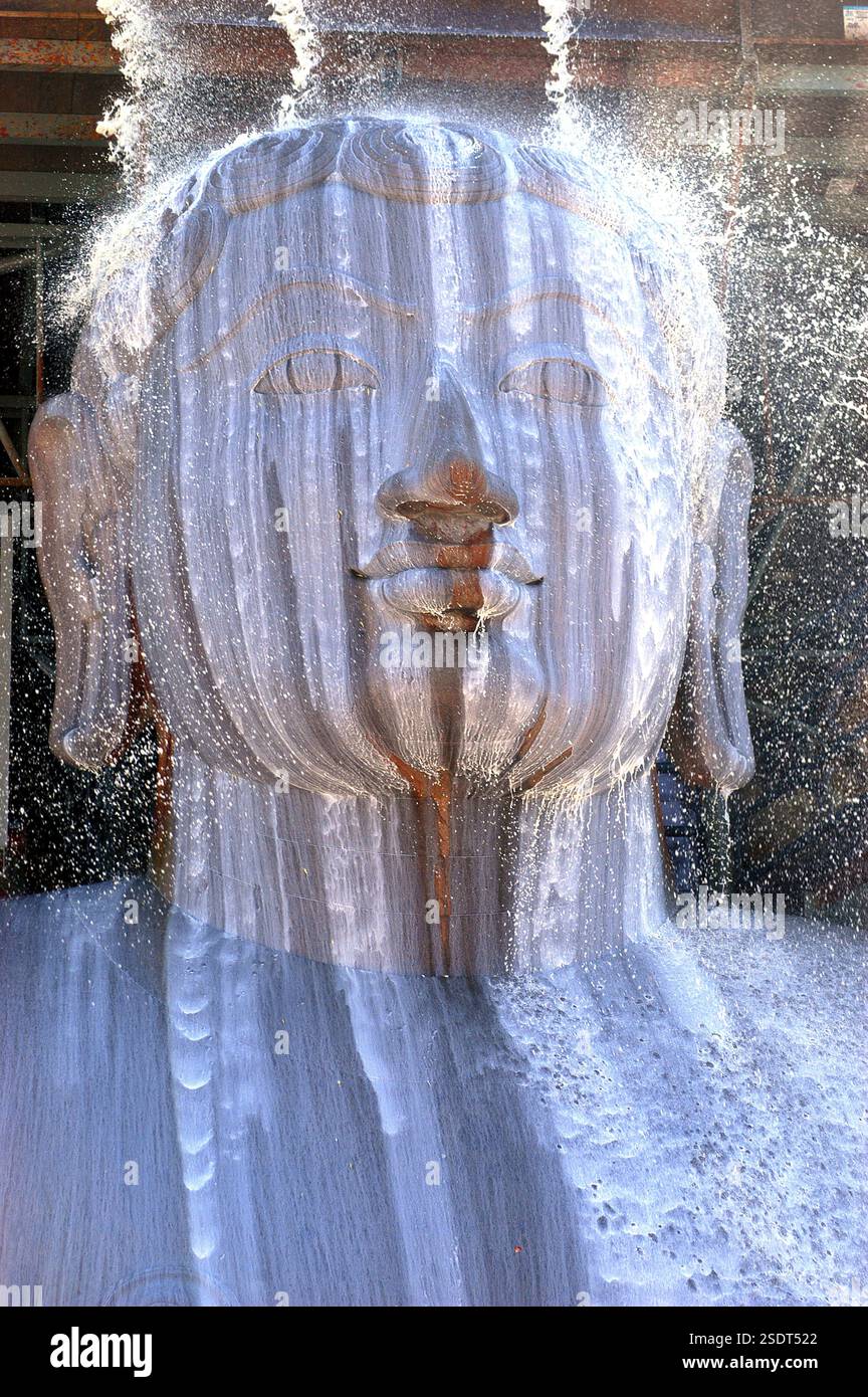 Milk pouring on face of 57 feet high statue of lord Bahubali known as ...