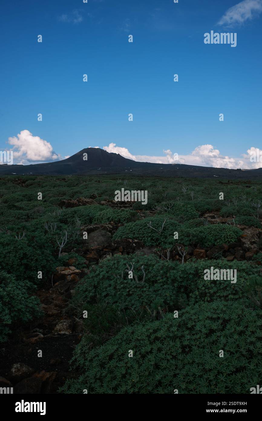 Breathtaking volcanic scenery with ebony sands, dramatic peaks, and ...