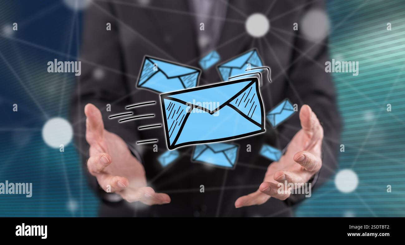 E-mail concept above the hands of a man in background Stock Photo - Alamy