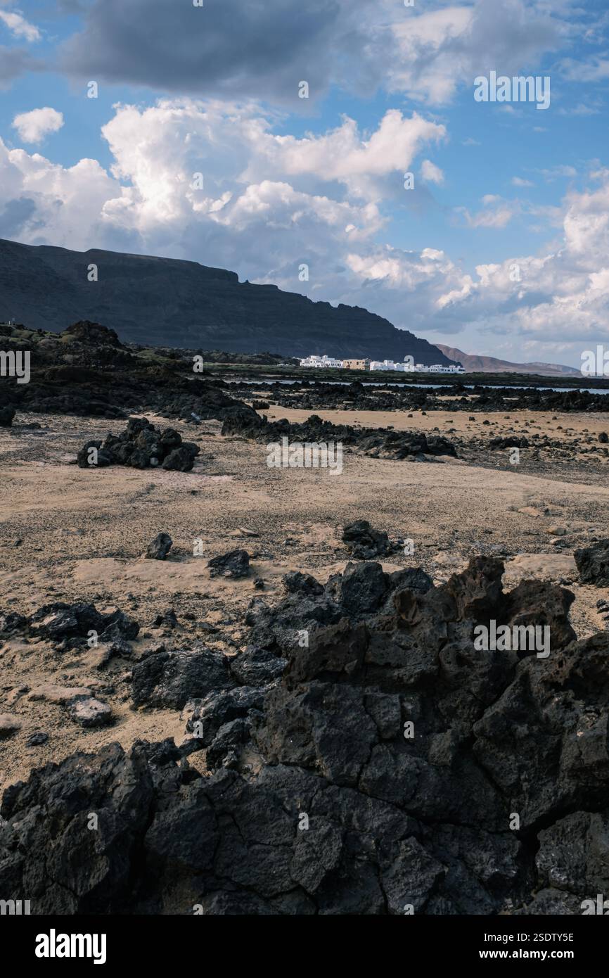 Breathtaking volcanic scenery with ebony sands, dramatic peaks, and ...