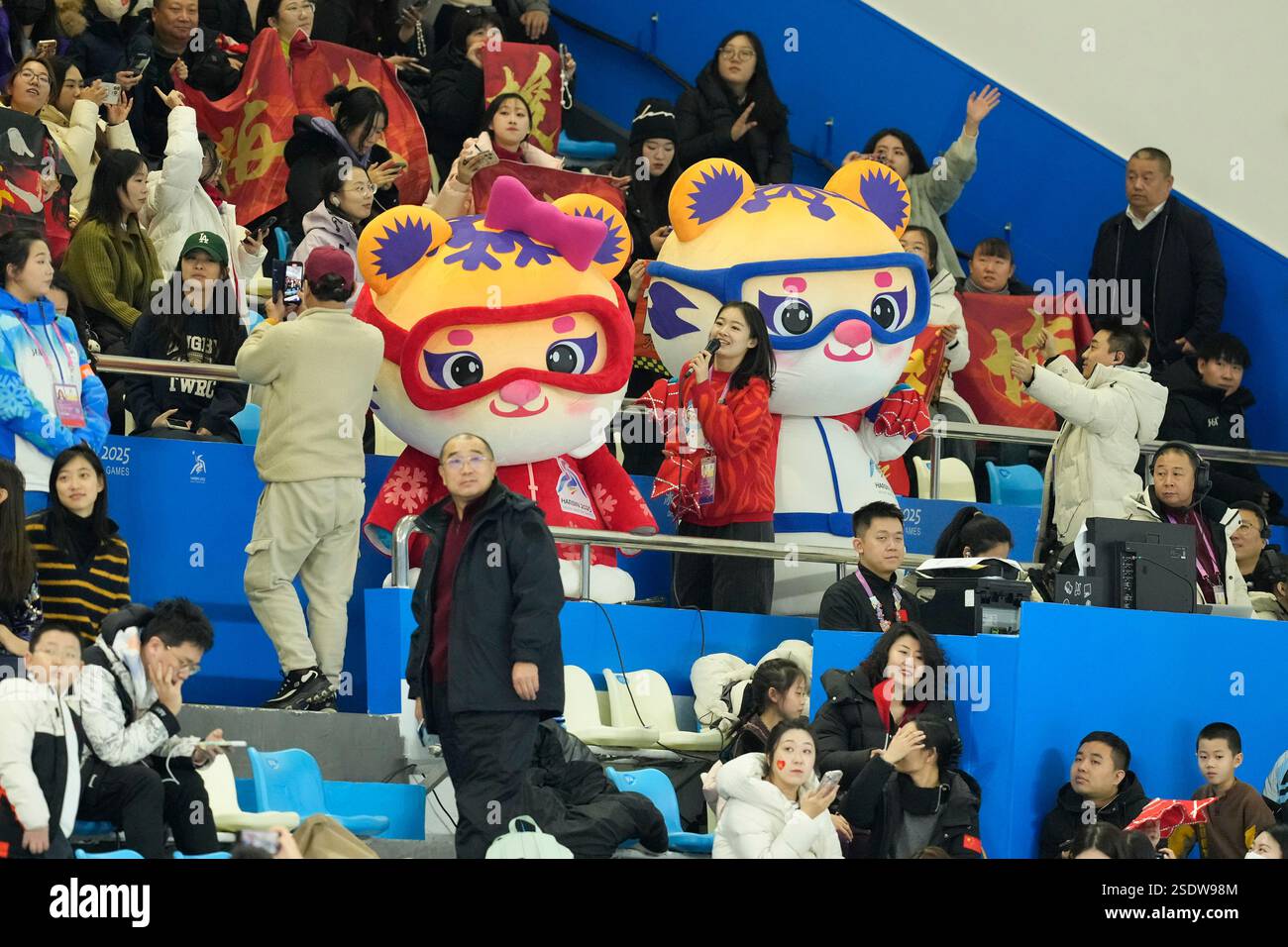 Mascots dance with the crowd at the Short Track Speed Skating during ...