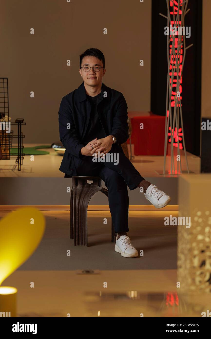 Dennis Cheung sits on his Triplex Stool at the opening ceremony of the ...