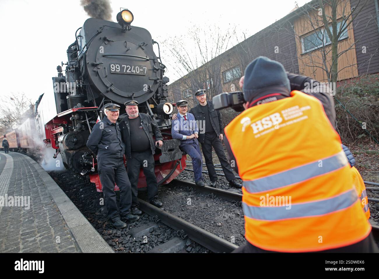 Wernigerode, Germany. 08th Feb, 2025. Stoker and train driver stand in ...