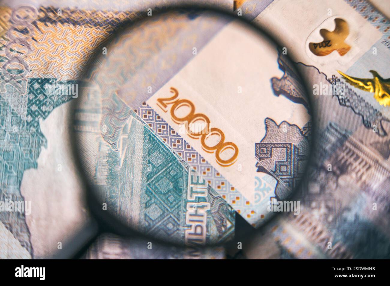 20,000 tenge banknote through a magnifying glass. Modern corruption ...