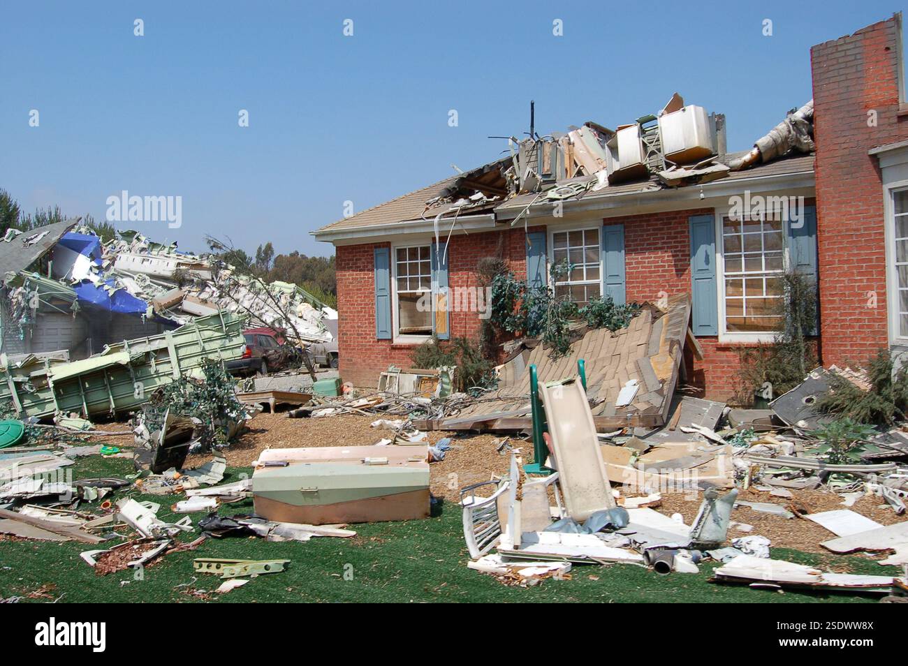 A severely damaged house after a powerful hurricane, with debris ...