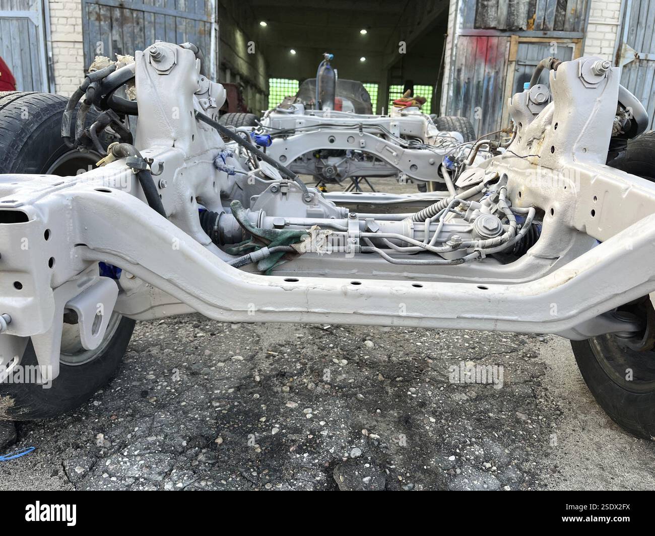 View of a car's underside showing the suspension and frame in a ...