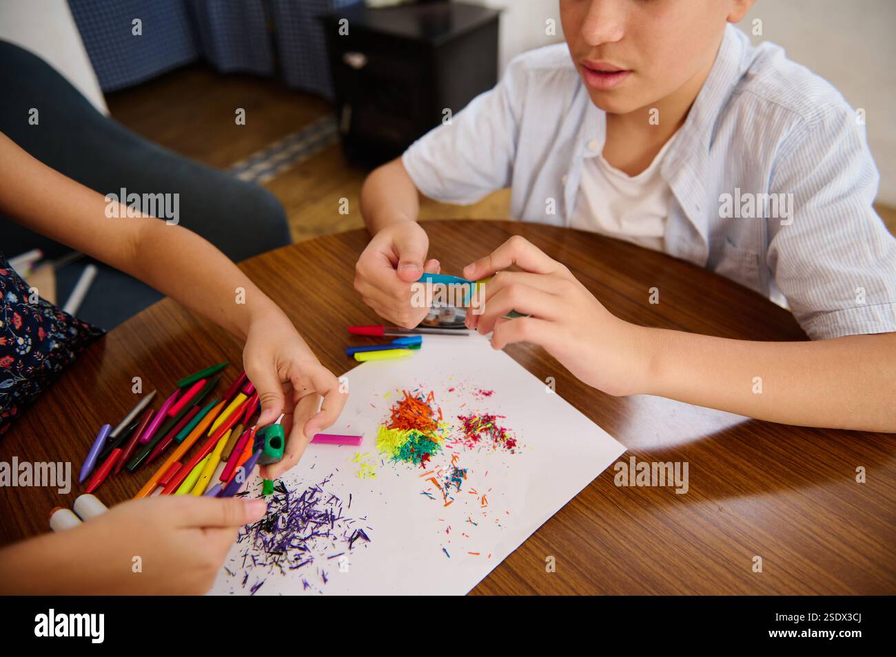 Young children engaging in a creative art project using colorful ...